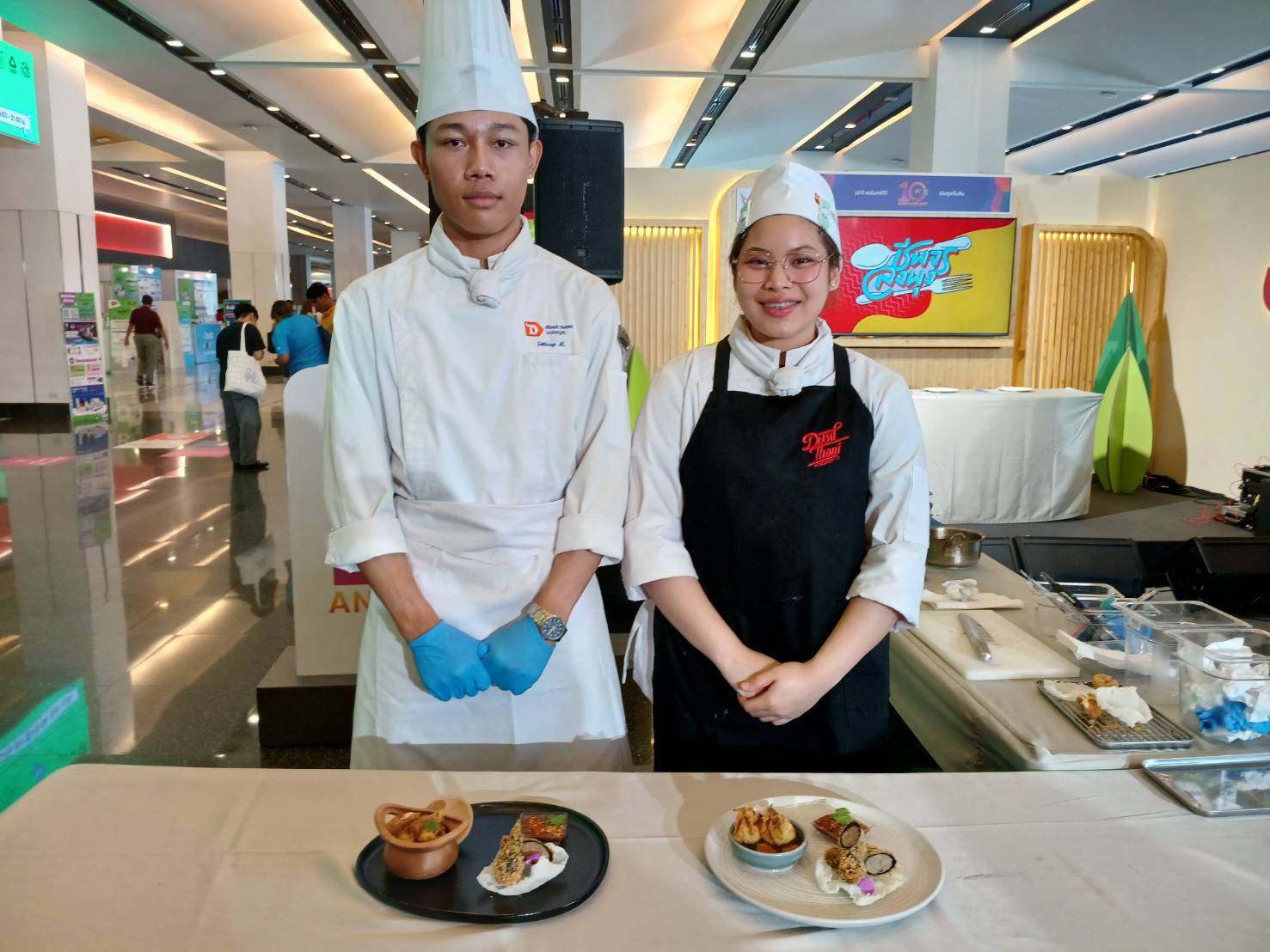 Instructors and students of Dusit Thani College showcase culinary and towel folding skills at ...